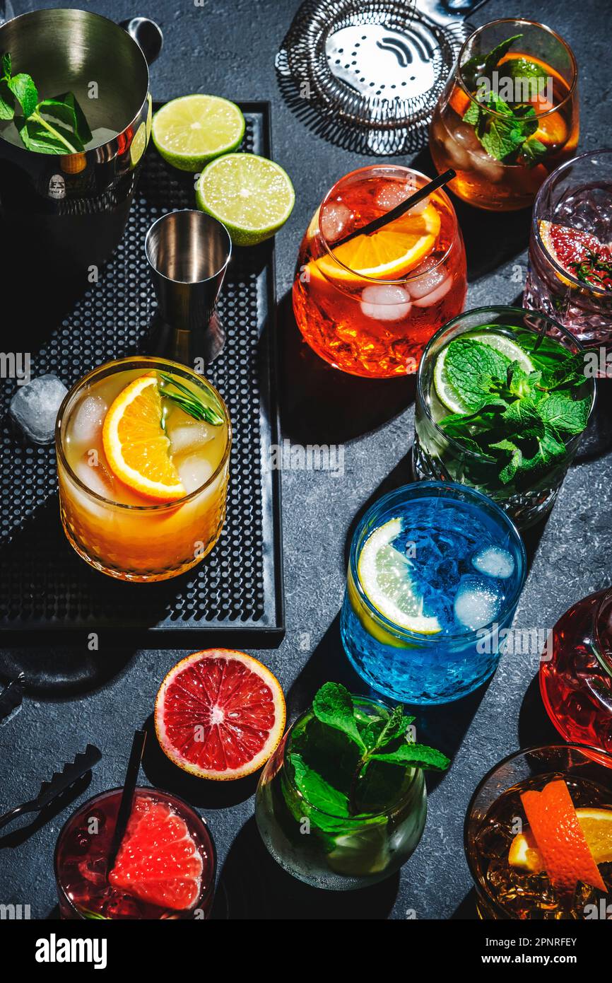 Cocktails set on black bar counter, top view. Mixology concept ...