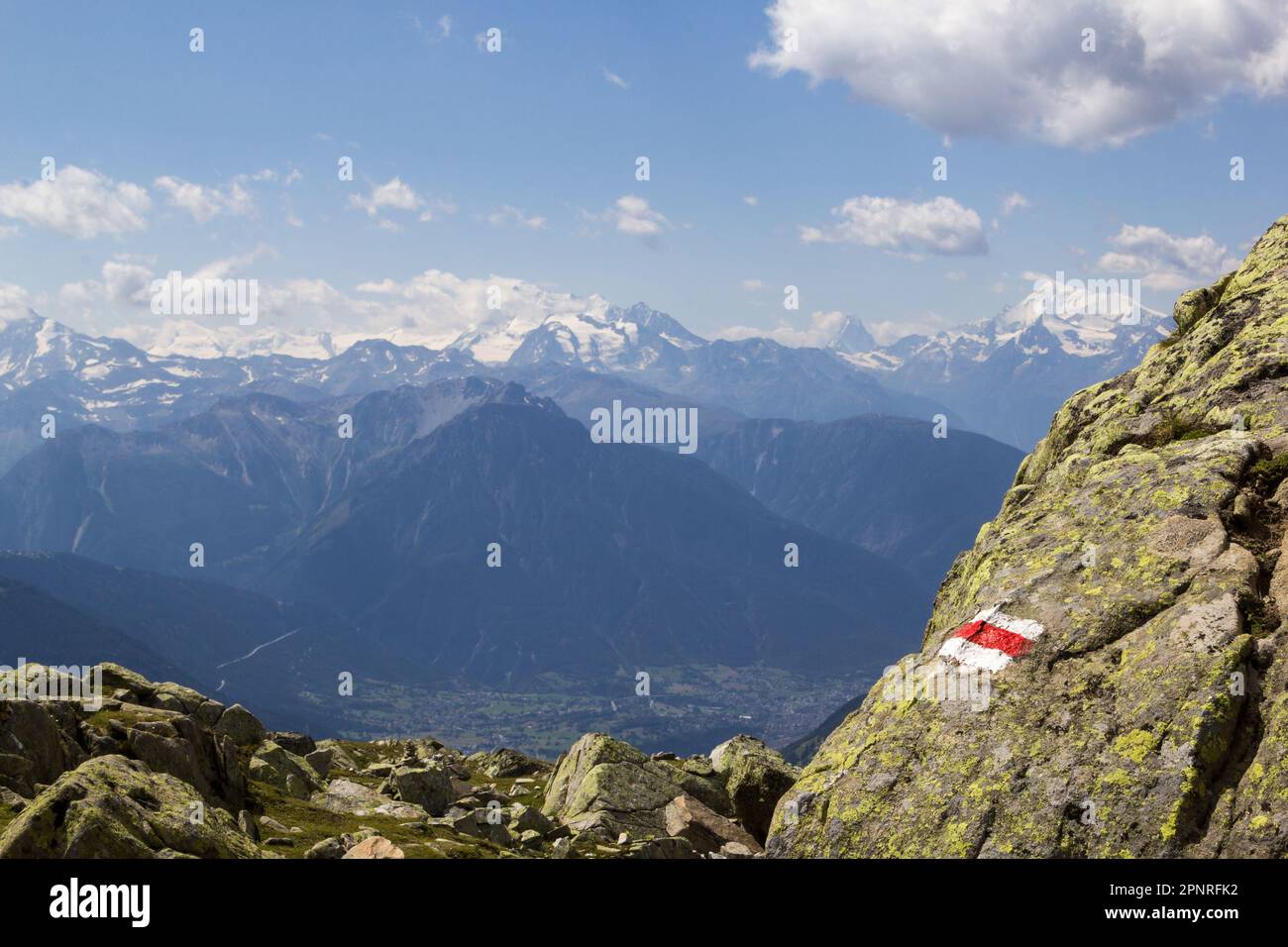 Hiking trails on the Swiss Alps, marked by a red and white bars as more ...