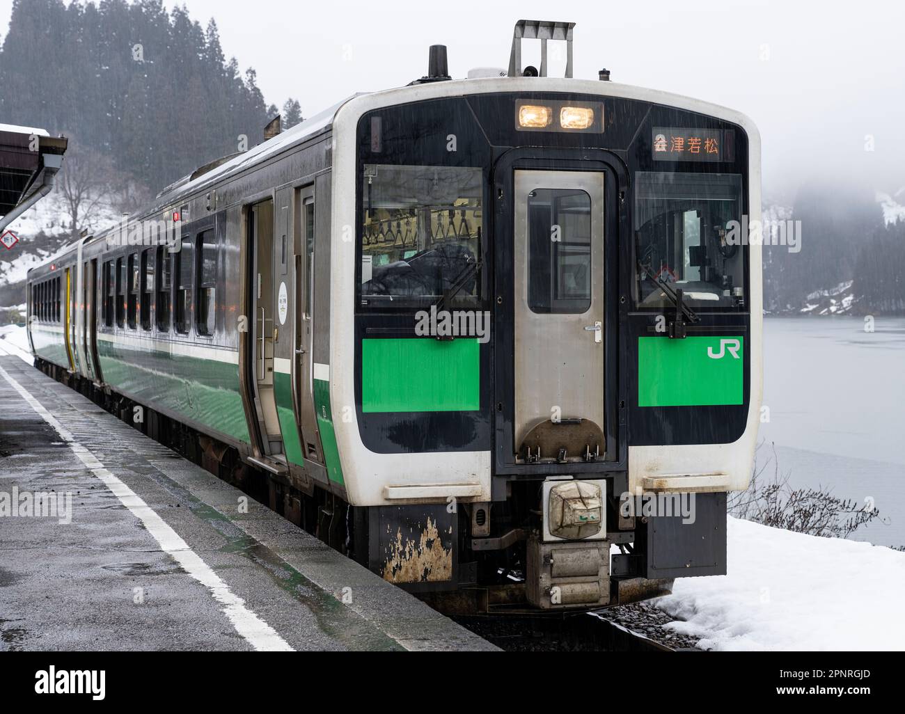 A JR East KiHa E120 train at Aizu-Kawaguchi Station on the Tadami Line ...
