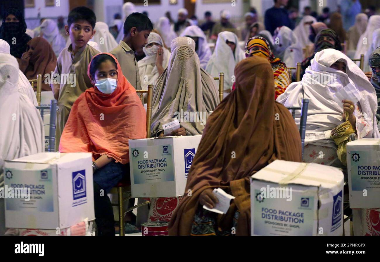 Volunteers distribute relief goods among needy people during food aids ...