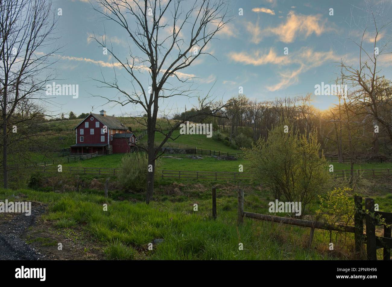 United States: April, 15 2023: The sun rises over an old barn along ...