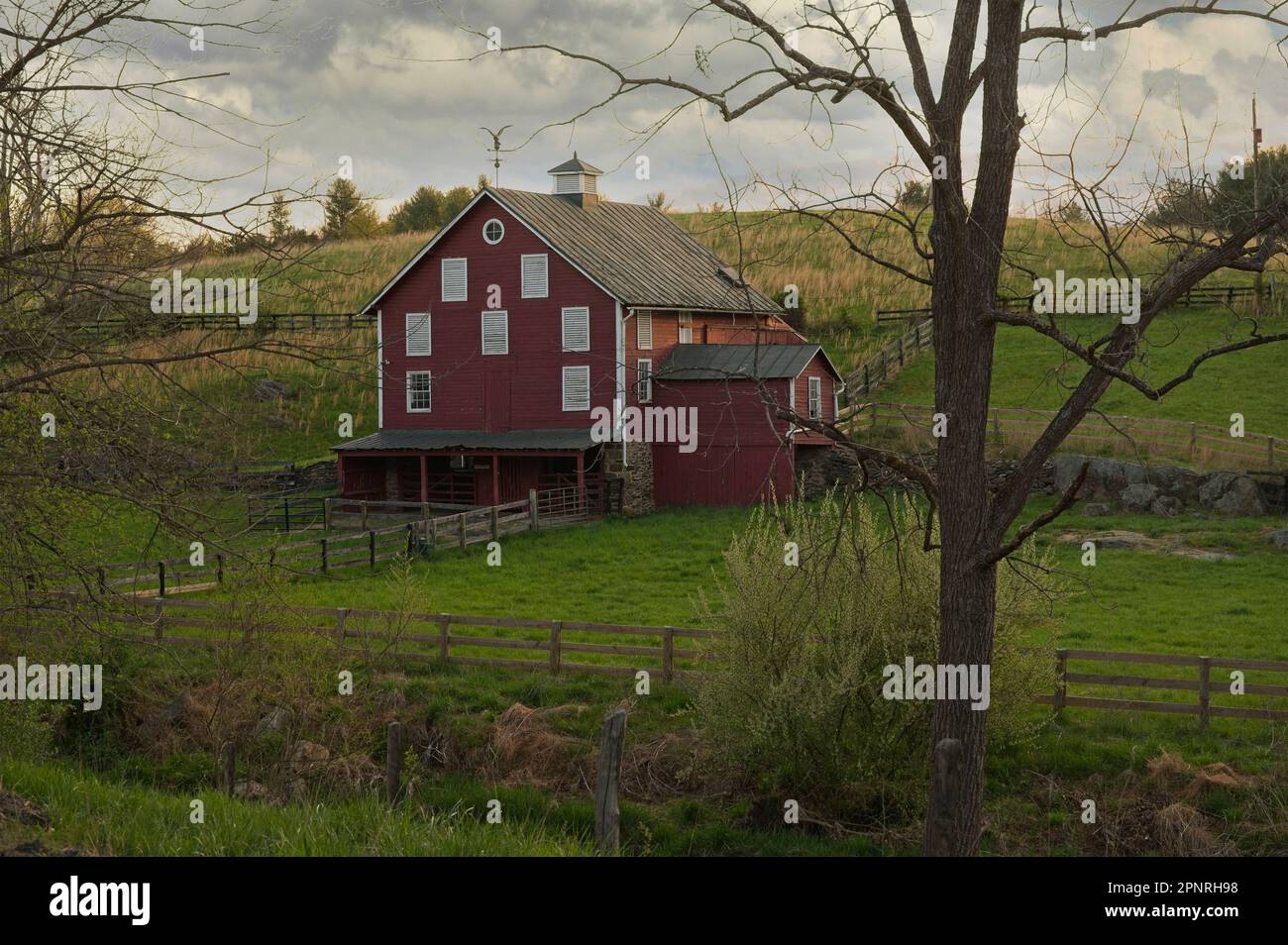 United States: April, 15 2023: The sun rises over an old barn along ...