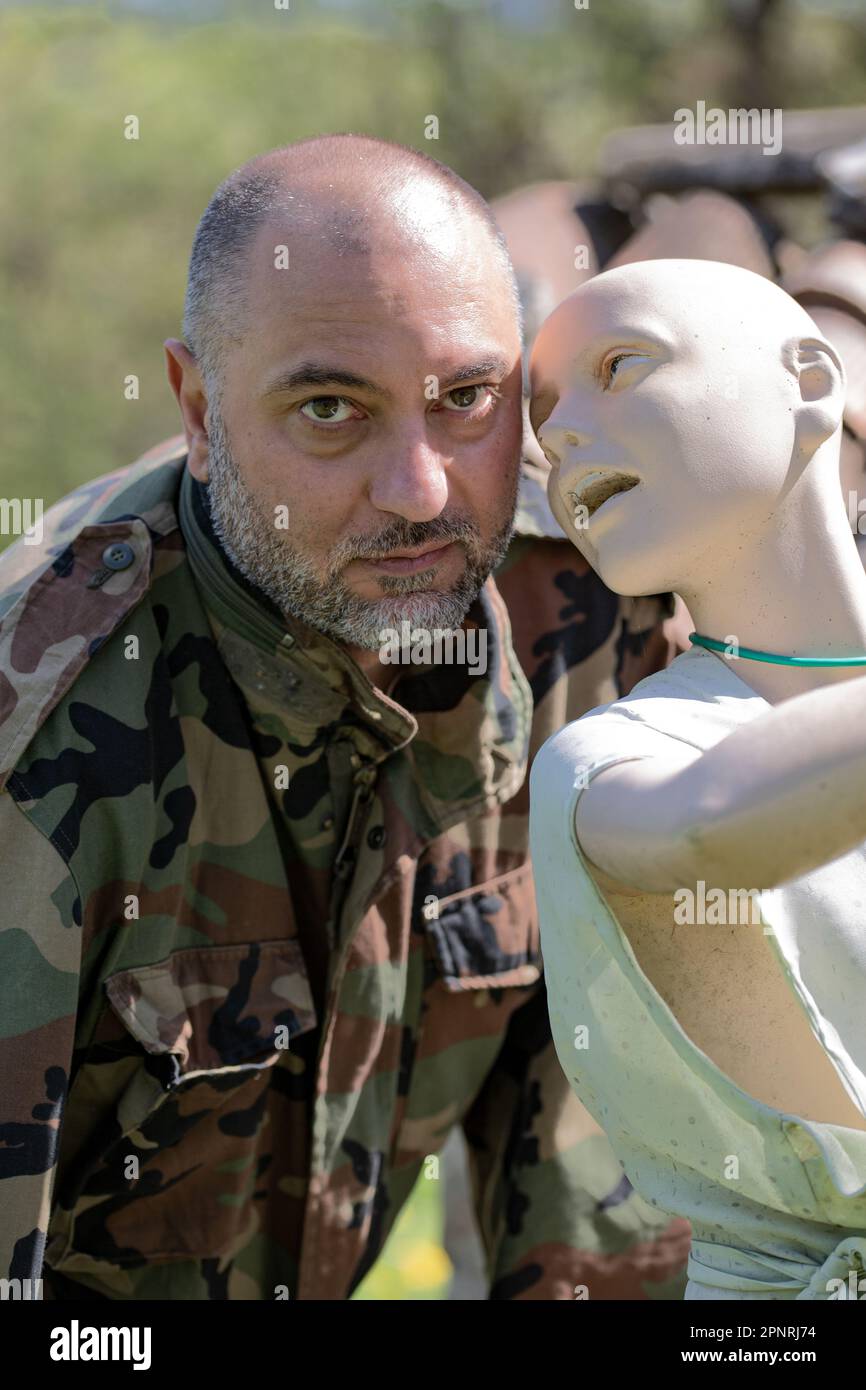 clothing mannequin used as a sparrow scarer Stock Photo - Alamy