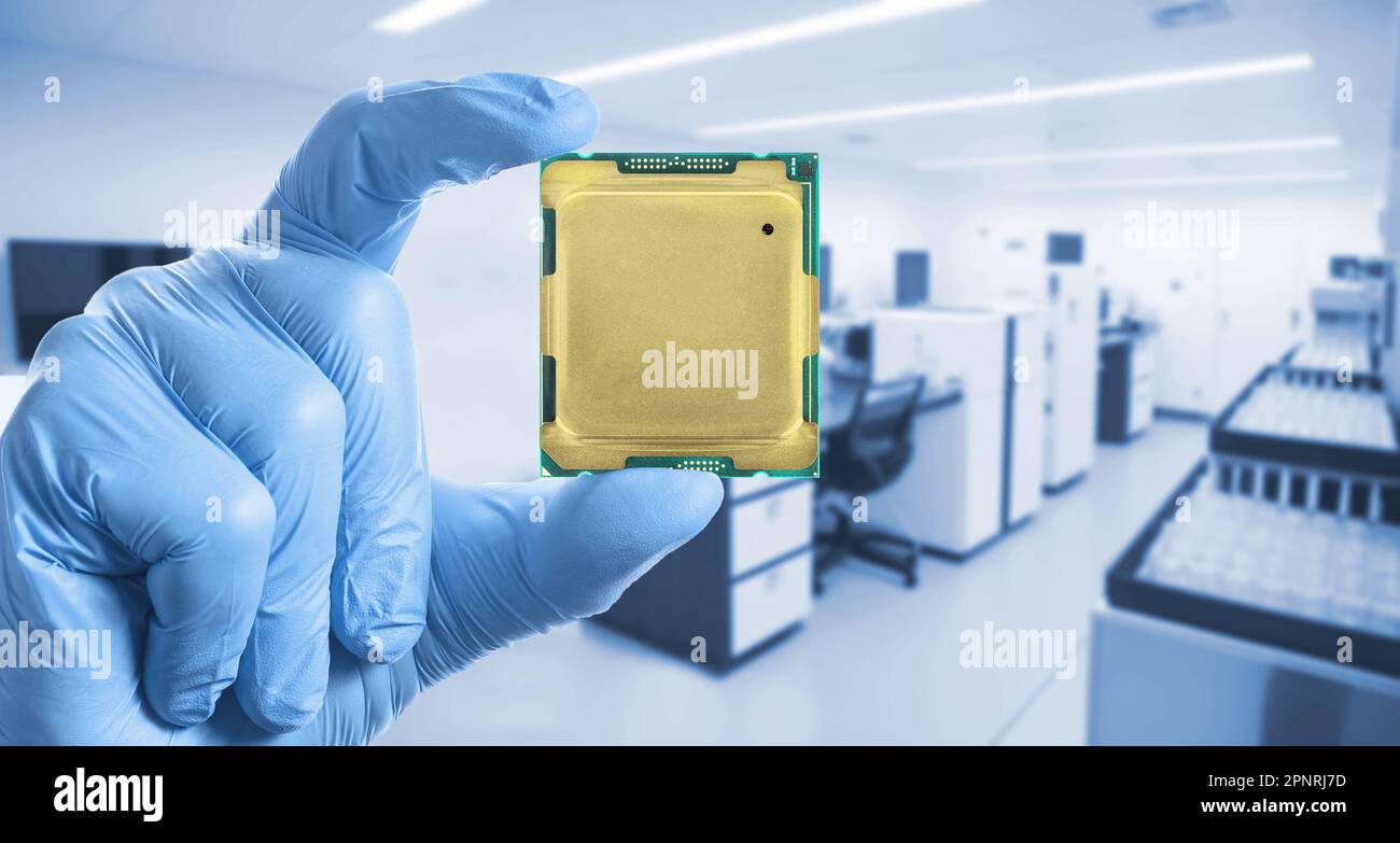 Laboratory Scientist holds a Modern Microprocessor Chip in Hand ...