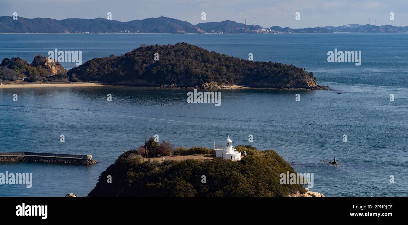 Nabeshima Lighthouse on the Seto Inland Sea in Japan, seen from a train ...