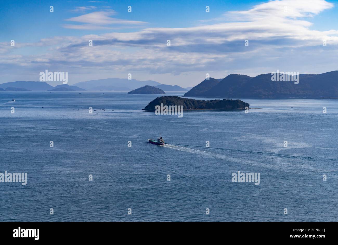 Ships and boats on the Seto Inland Sea in Japan, seen from a train ...