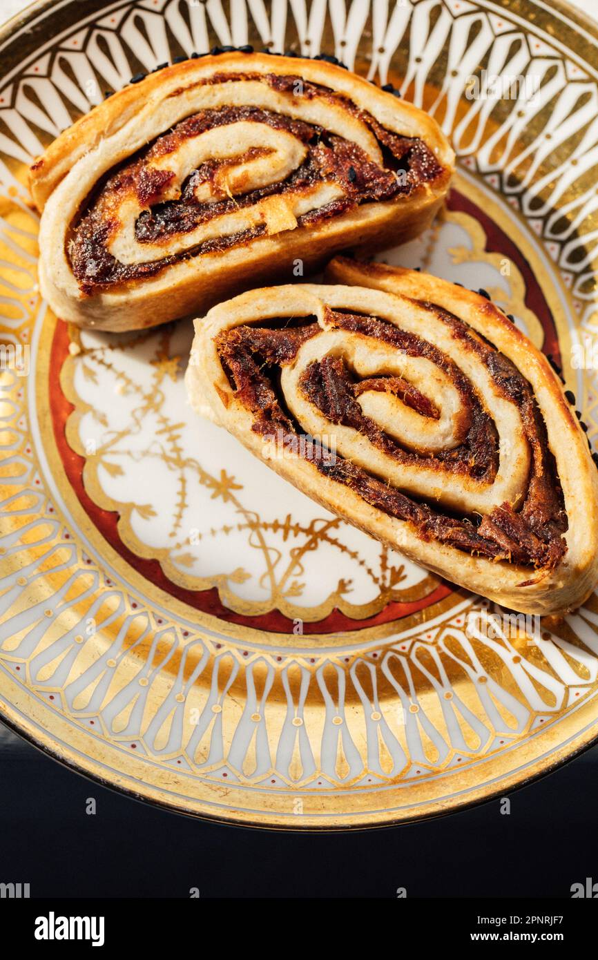 Kleicha, Iraqi date cookies in spiral form with nigella seeds on ornate ...