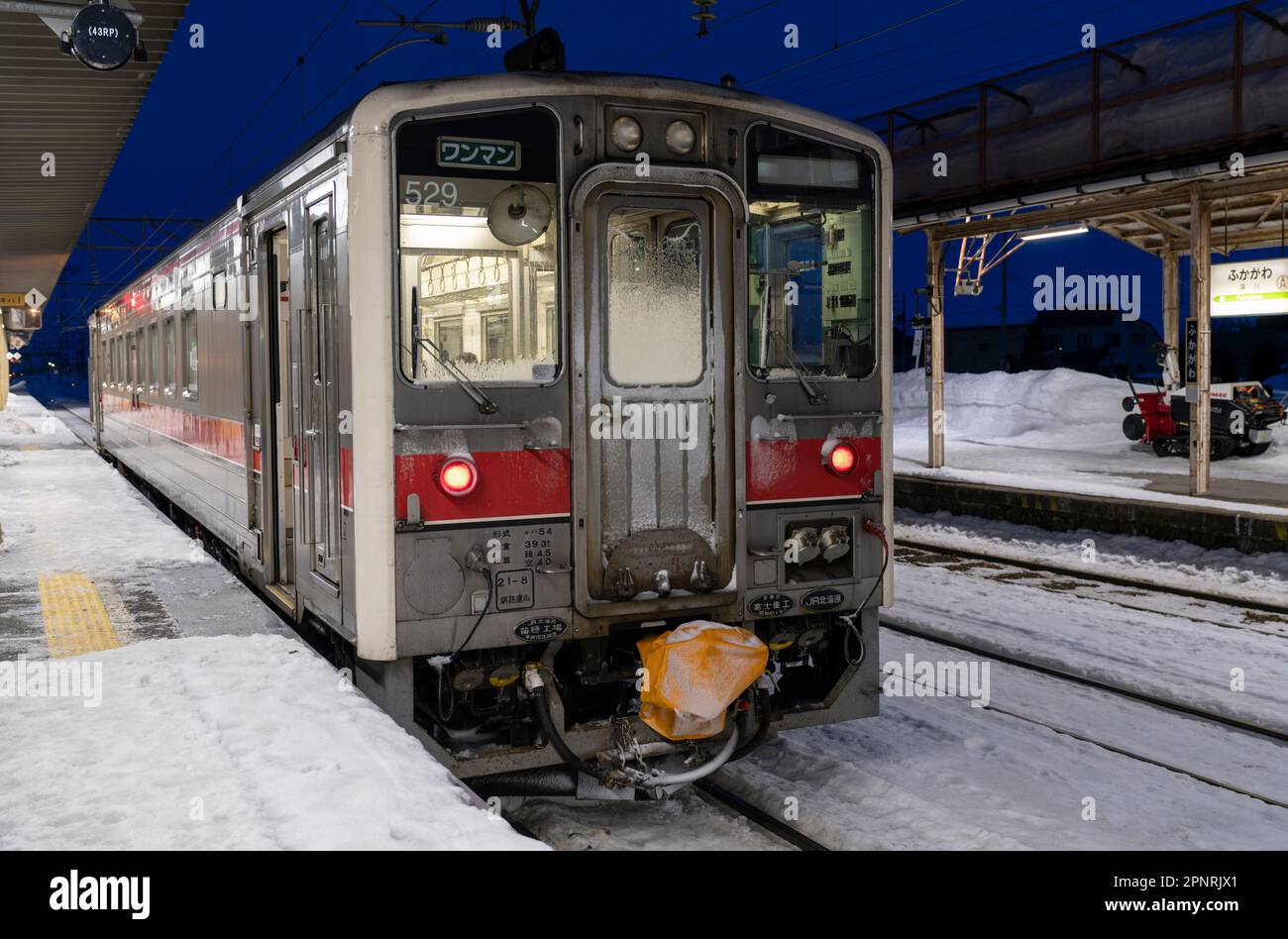 A JR Hokkaido KiHa 54 series train on a winter morning at Fukagawa ...