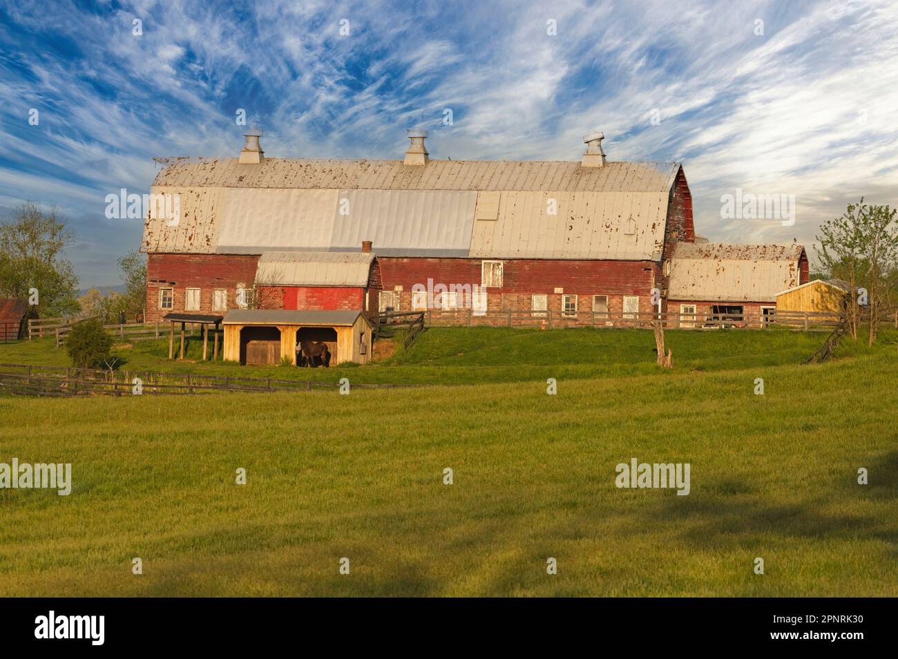 United States: April, 15 2023: Sunrise over a farm barn near the ...