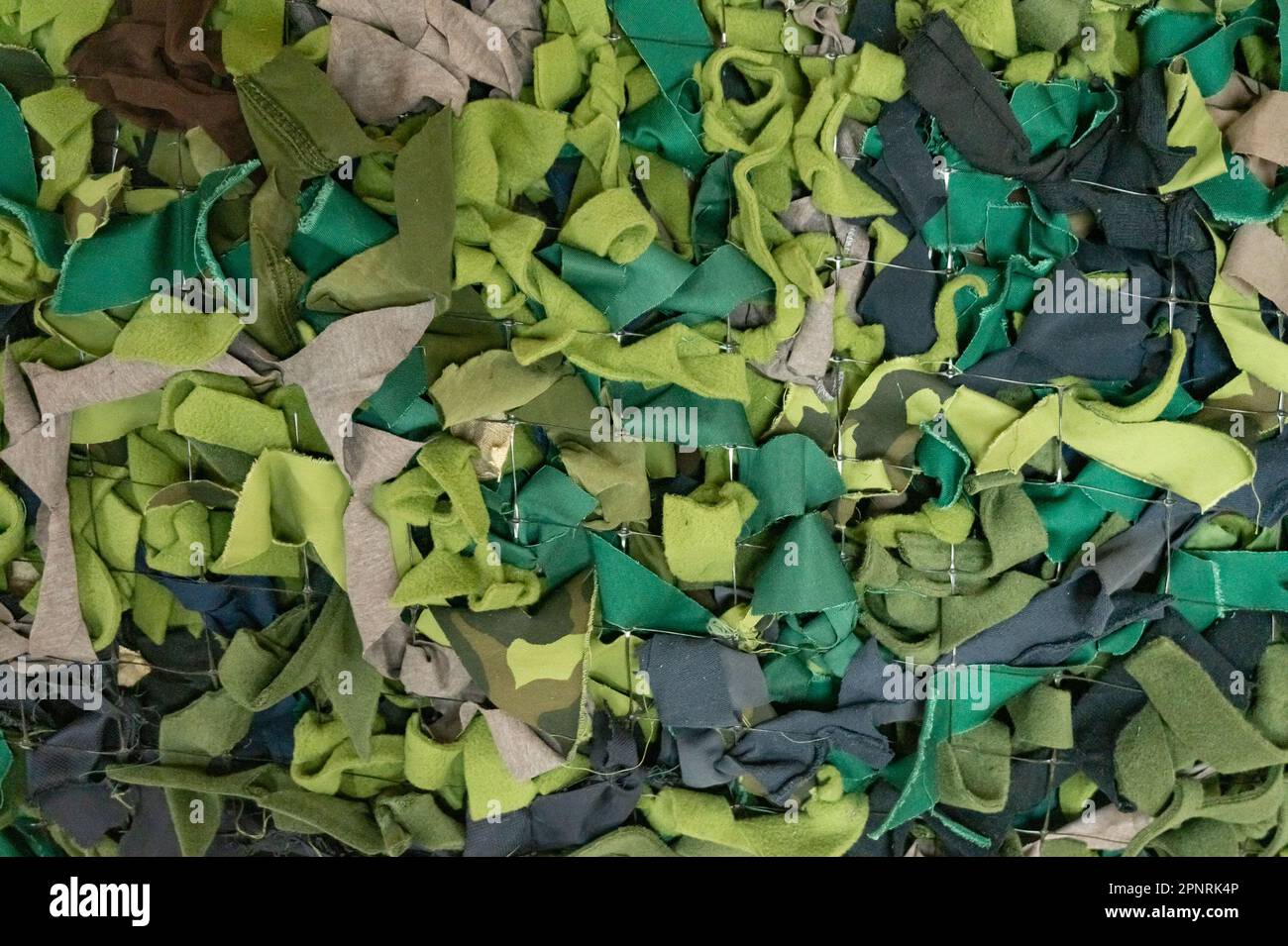 Homemade camouflage nets made from scraps of fabric to help the ...