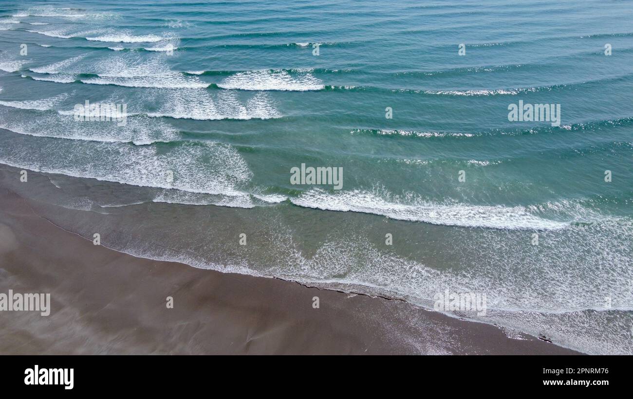 Wet coastal sand and sea waves, top view. Sandy beach and ocean tide ...