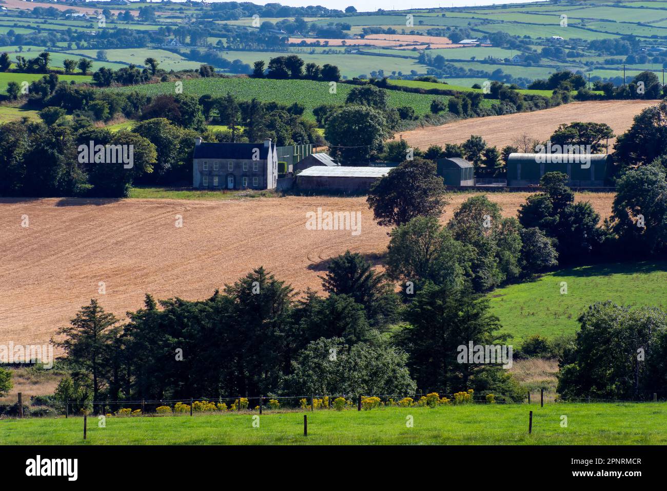 A farmer's dwelling among the fields in Ireland. Irish countryside ...