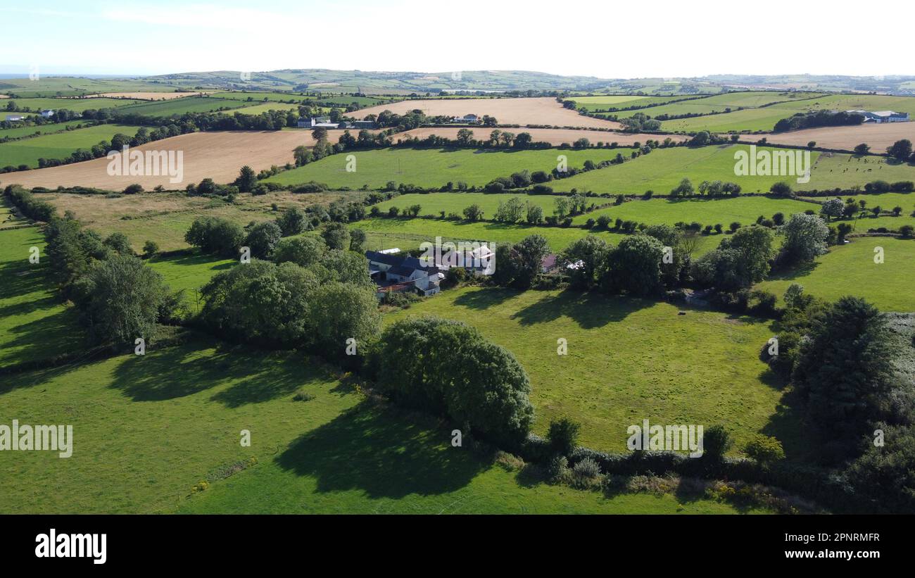 fields and trees near a farm in Ireland, summer, top view. Irish ...