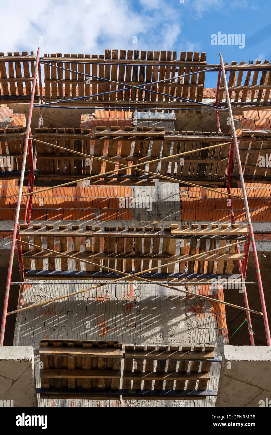Construction site with building and scaffolding, close up Stock Photo ...