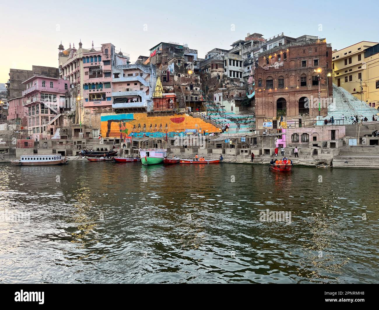 Evening boat cruise along the ghats of Ganga river at Varanasi in India ...