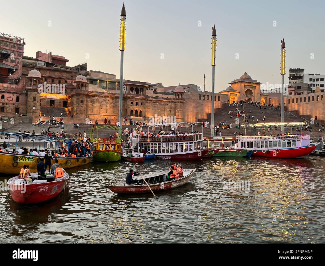 Evening boat cruise along the ghats of Ganga river at Varanasi in India ...