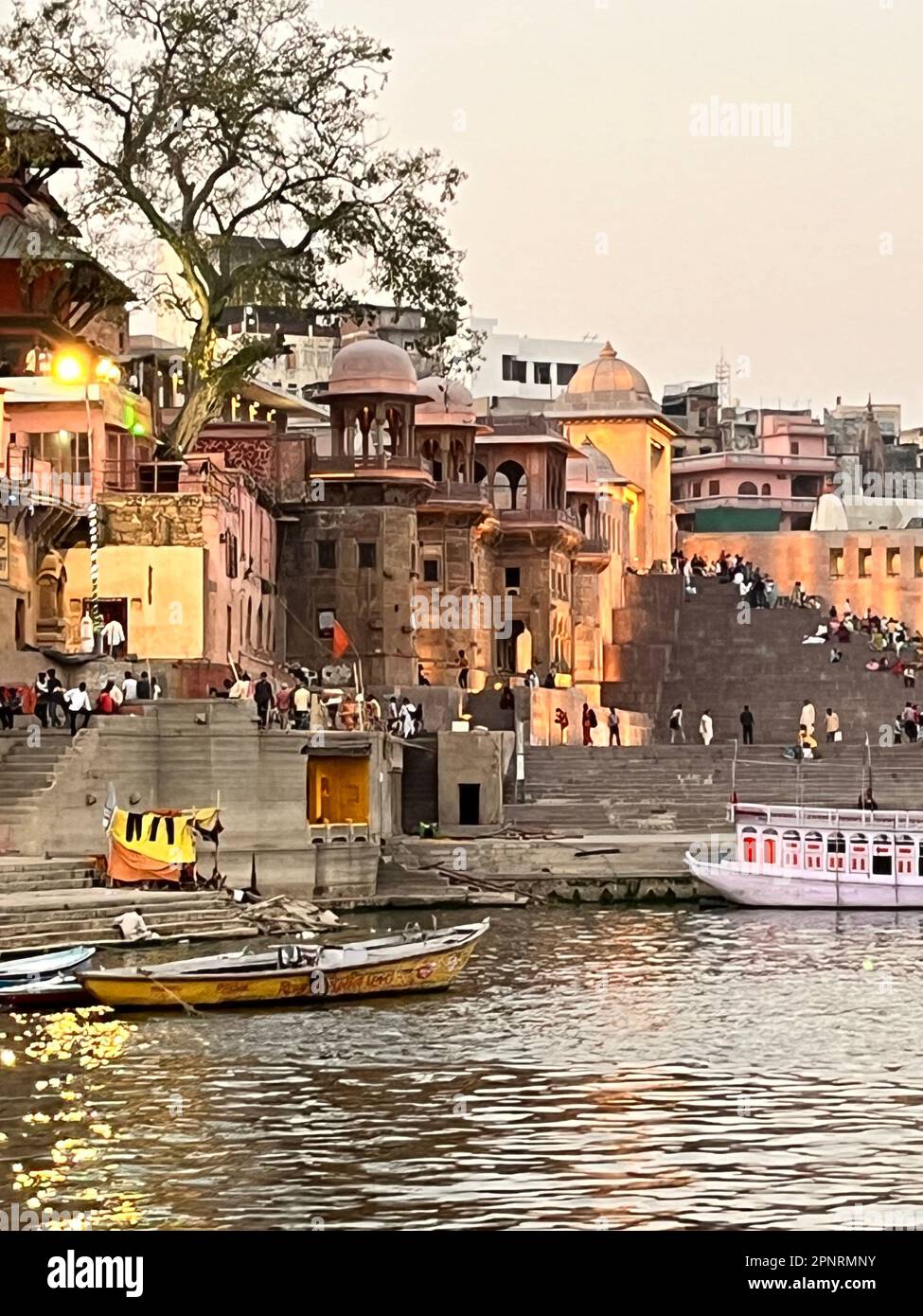 Evening boat cruise along the ghats of Ganga river at Varanasi in India ...