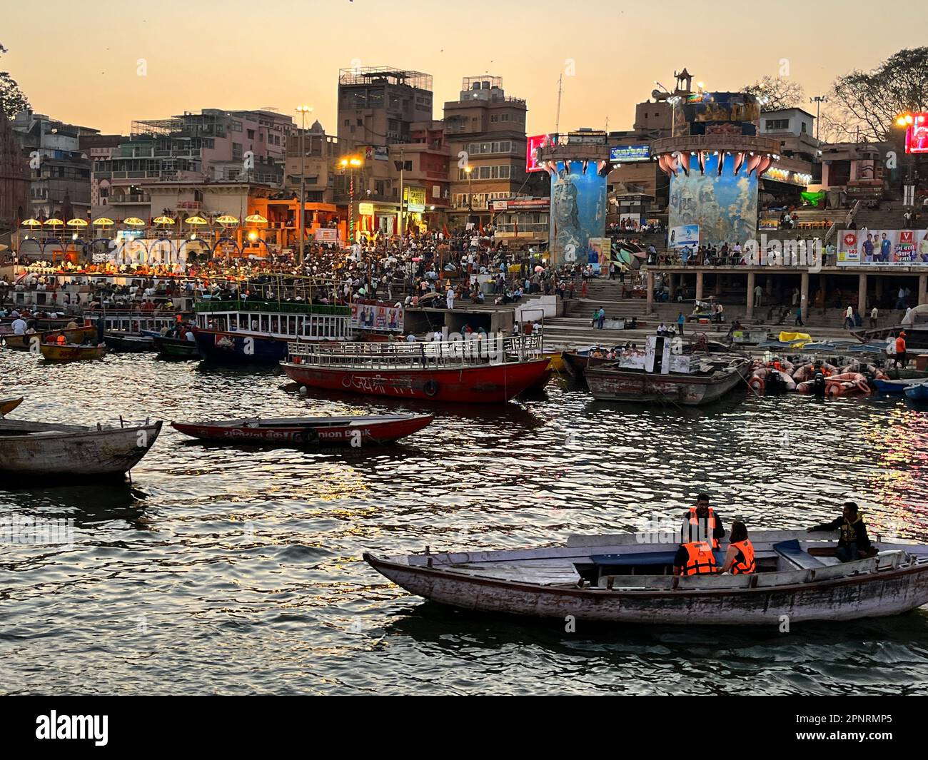 Evening boat cruise along the ghats of Ganga river at Varanasi in India ...
