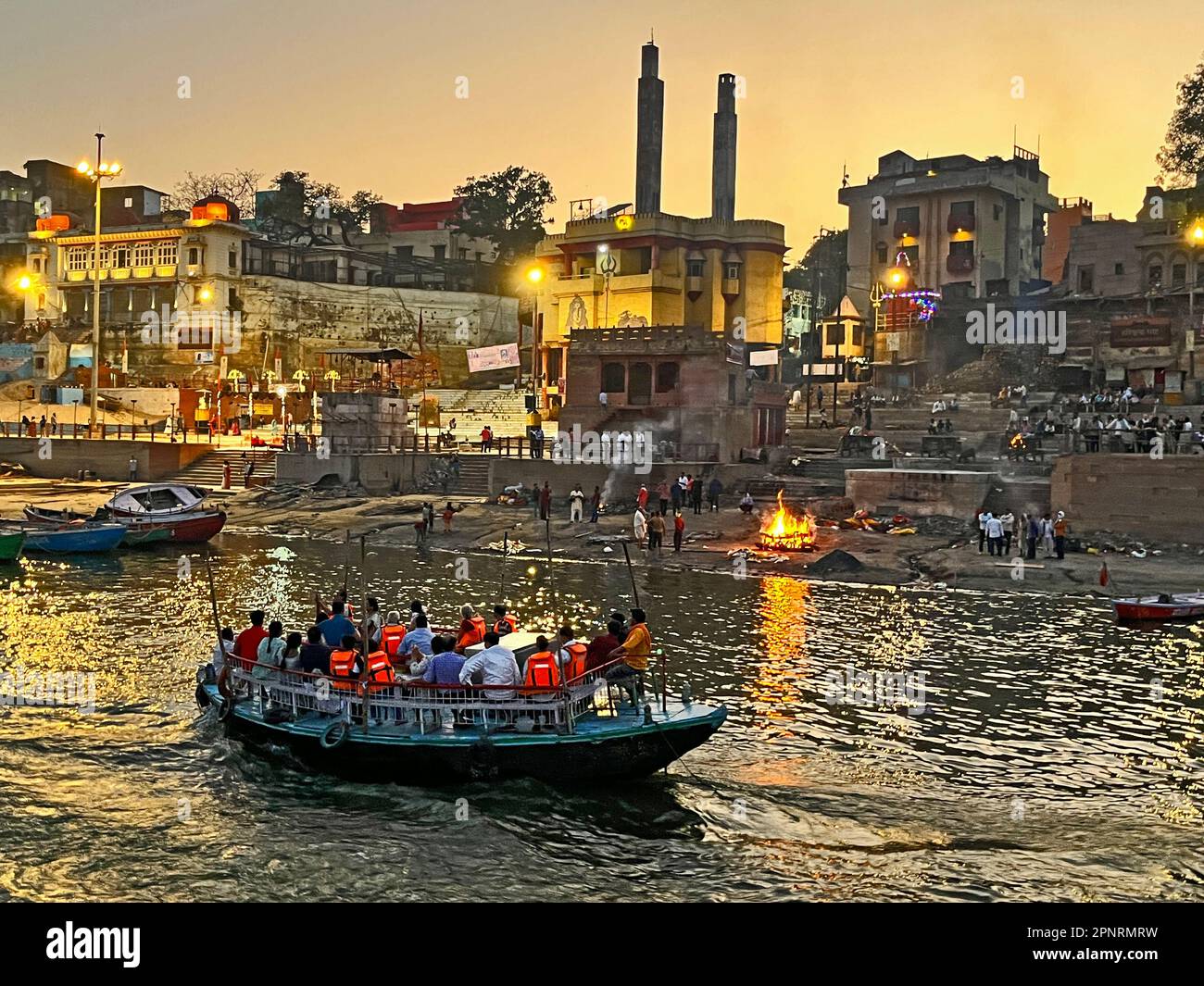 Evening boat cruise along the ghats of Ganga river at Varanasi in India ...