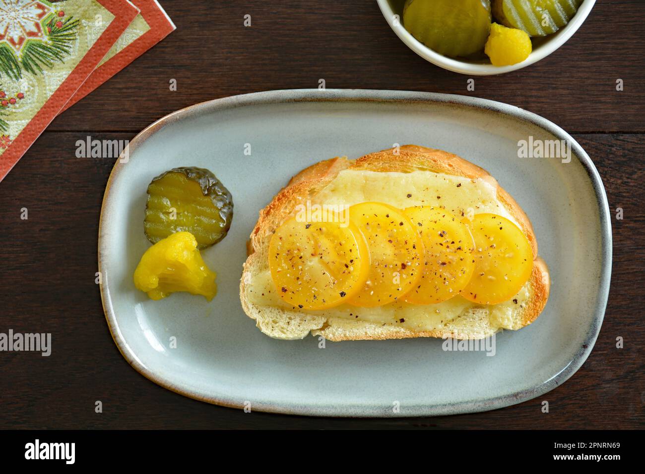 Toasted open-face cheddar cheese and romanella tomato with sweet ...