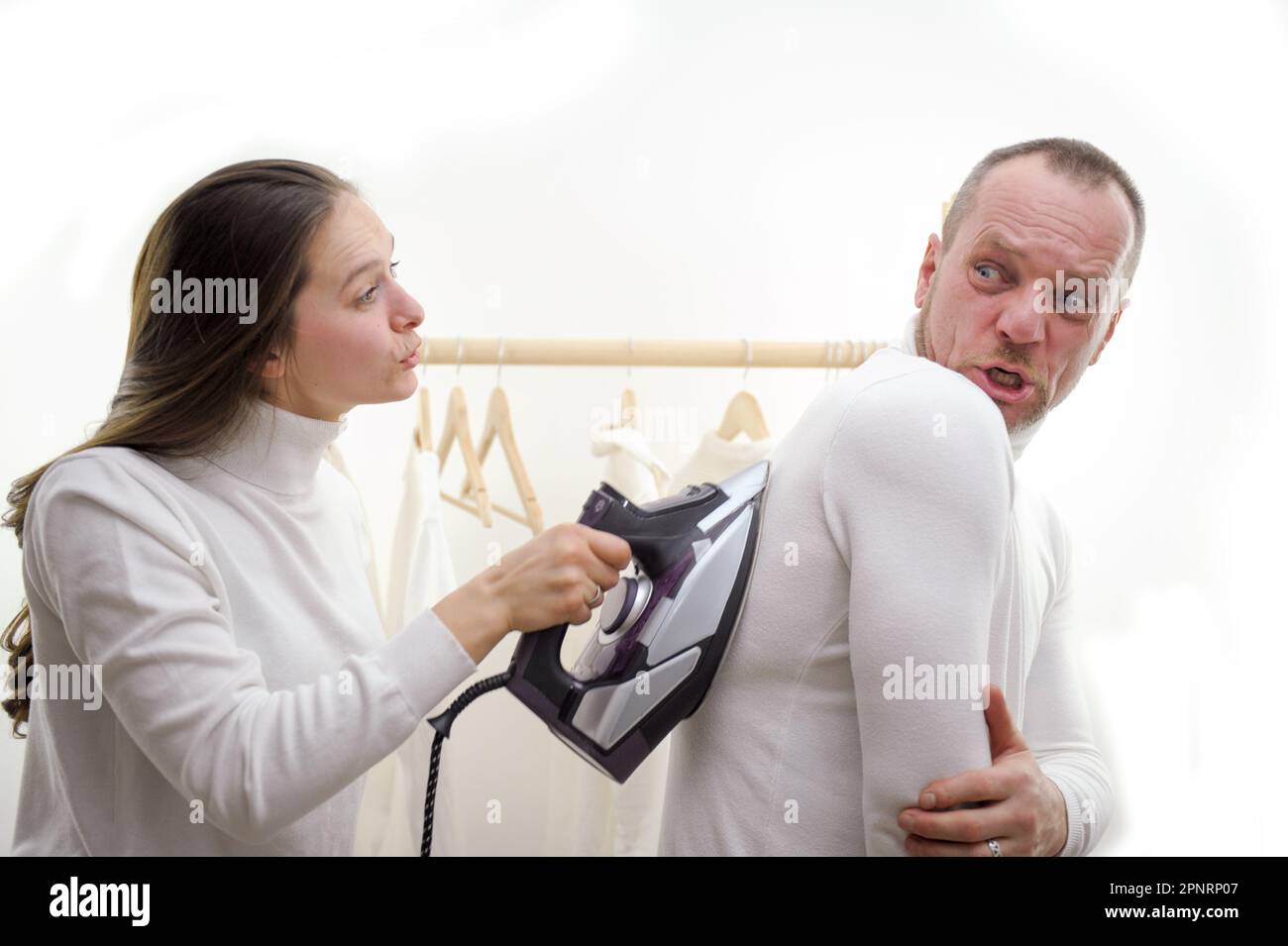 Female hand ironing clothes top view isolated on white background ...