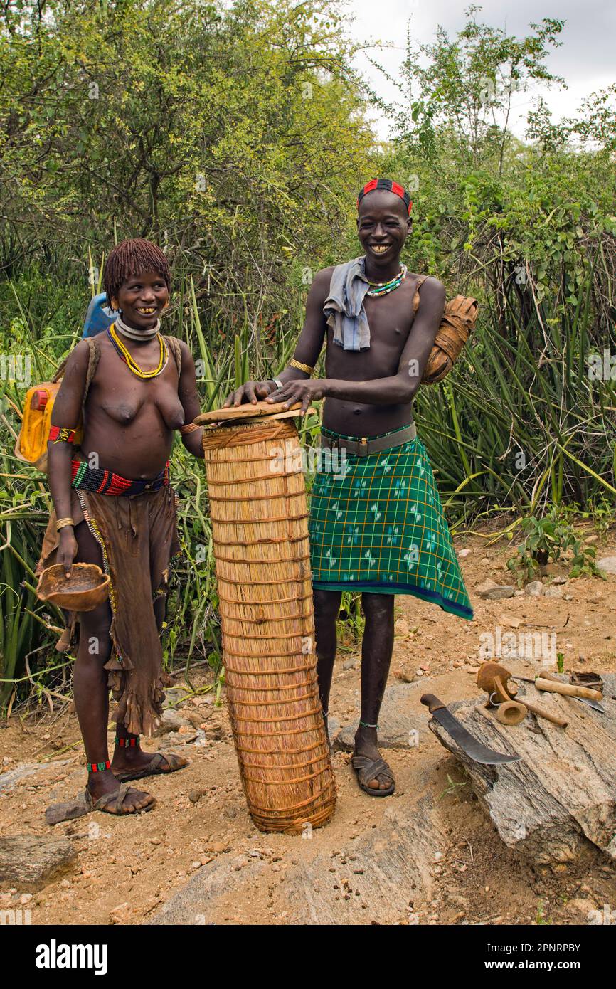 man with a beehive intended for repair on a tree Traditional beehives ...
