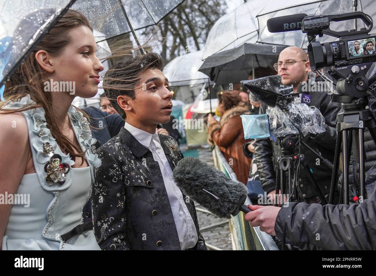 Ever Anderson, left, and Alexander Molony are interviewed upon arrival ...