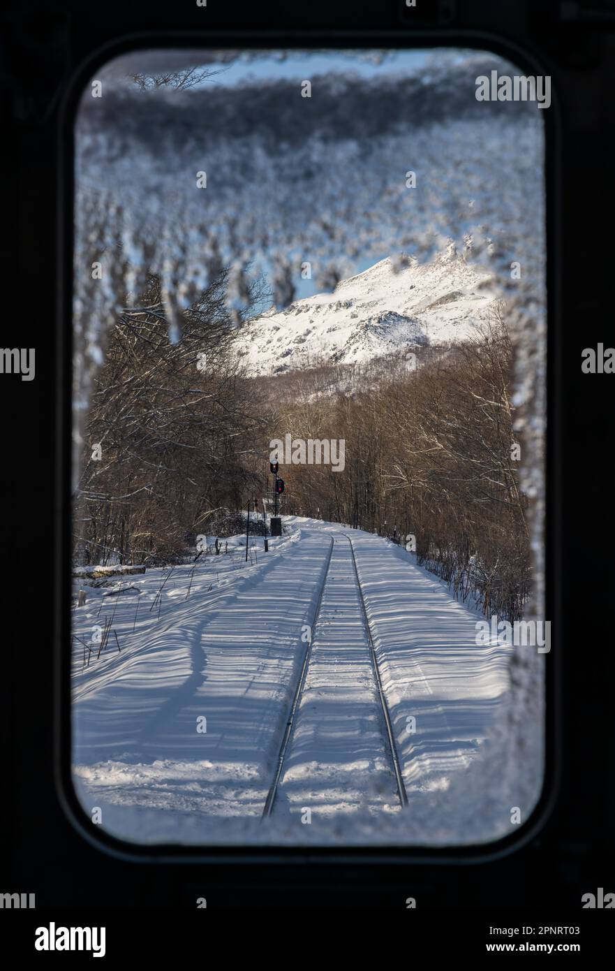 View through the front window of a JR Hokkaido train on the Senmo (or ...