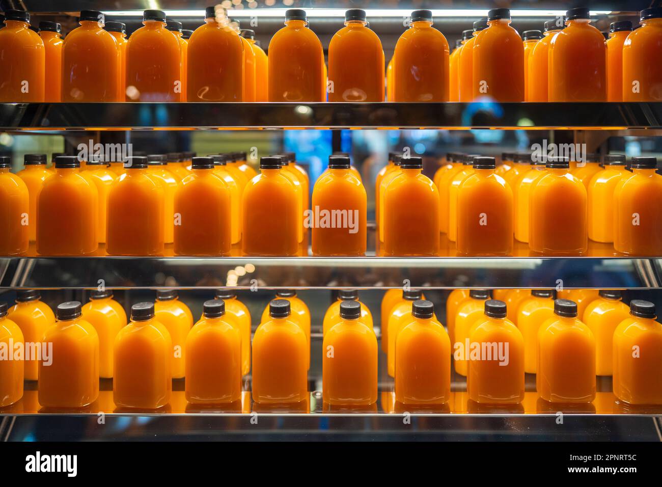 Bottles of orange juice on shelf hi-res stock photography and images ...