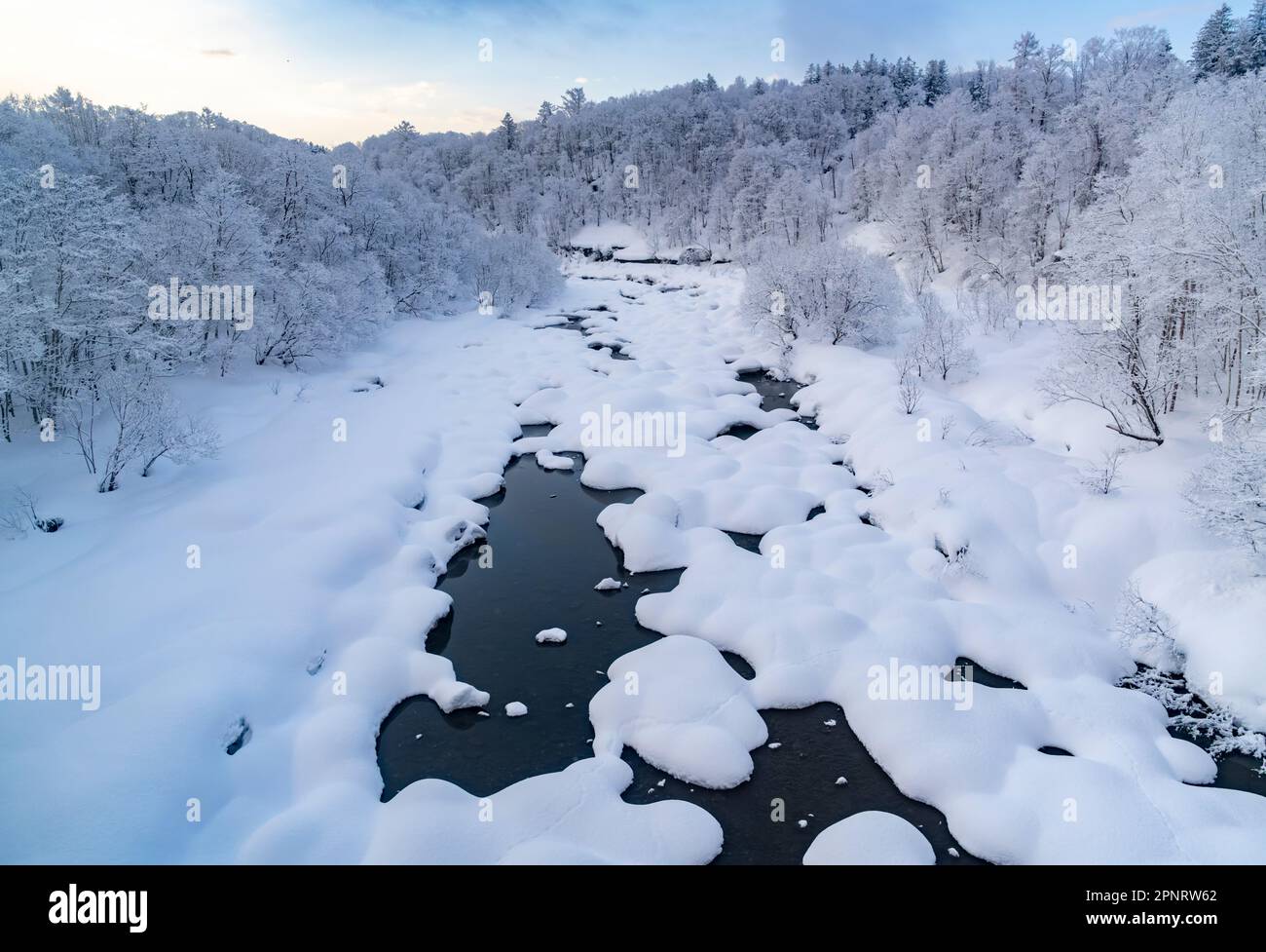 The Shiribetsu River on a snowy day seen from a JR Hokkaido train on ...