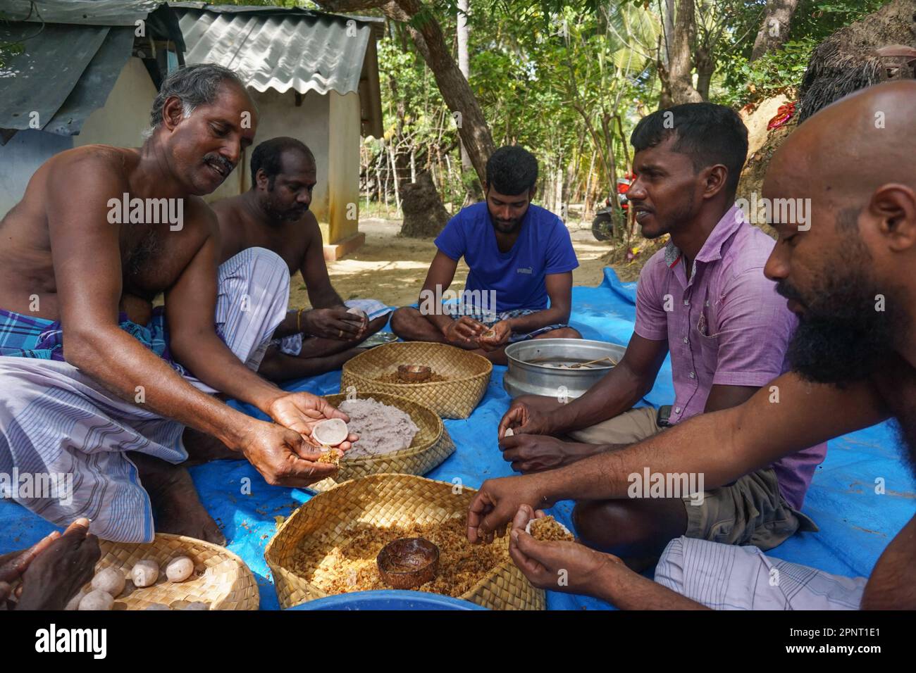 Family members of the founders of the Periya Thambiran temple make ...