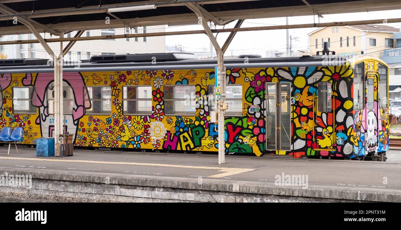 A colorfully decorated JR Shikoku local train at Uwajima Station in ...