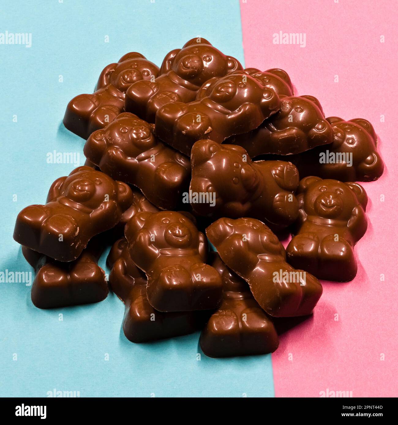 A pile of chocolate bears laid out on pink and blue card. A good mage ...