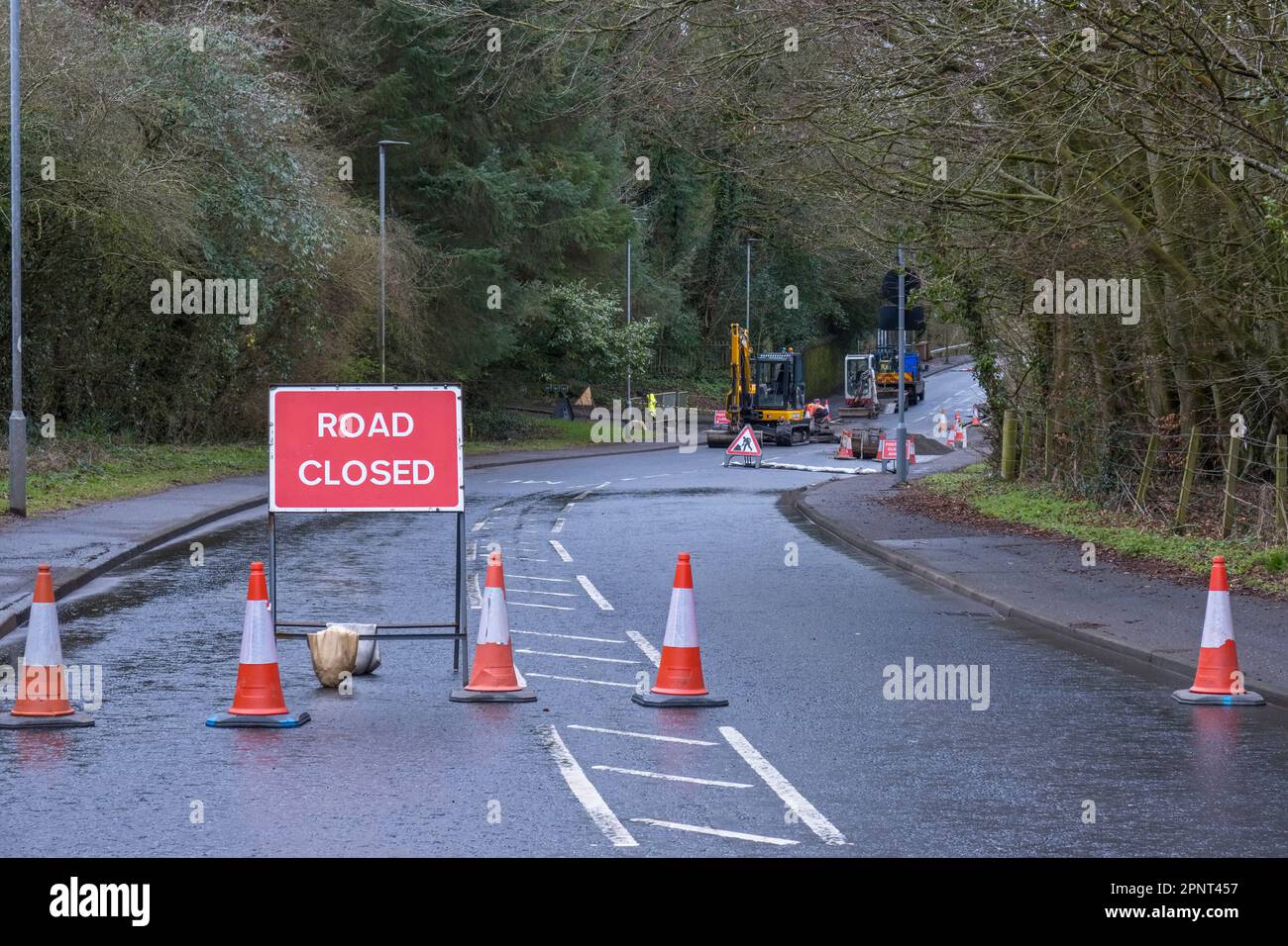 A Red Road Ahead Closed Sign and road works in operation about 150 feet ...