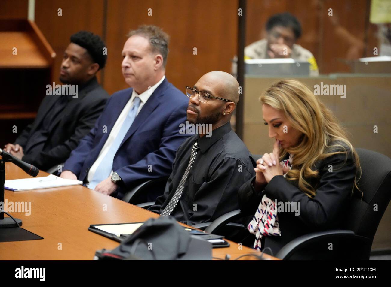 Juan Rayford, second from right, and Dupree Glass, far left, sit with ...