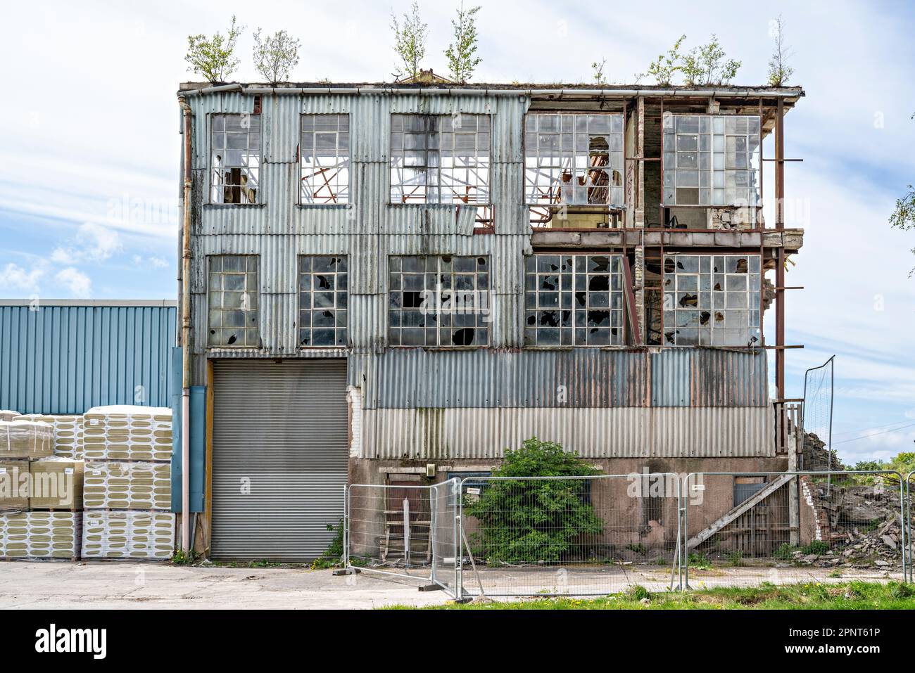 Industrial Building shell with broken windows Stock Photo - Alamy