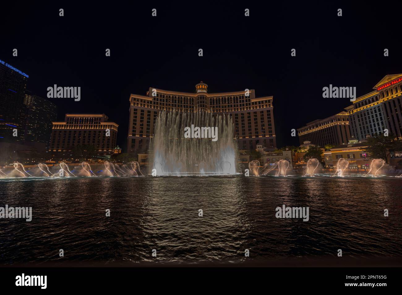 View of sights of Las Vegas at night on Strip overlooking fountains of ...