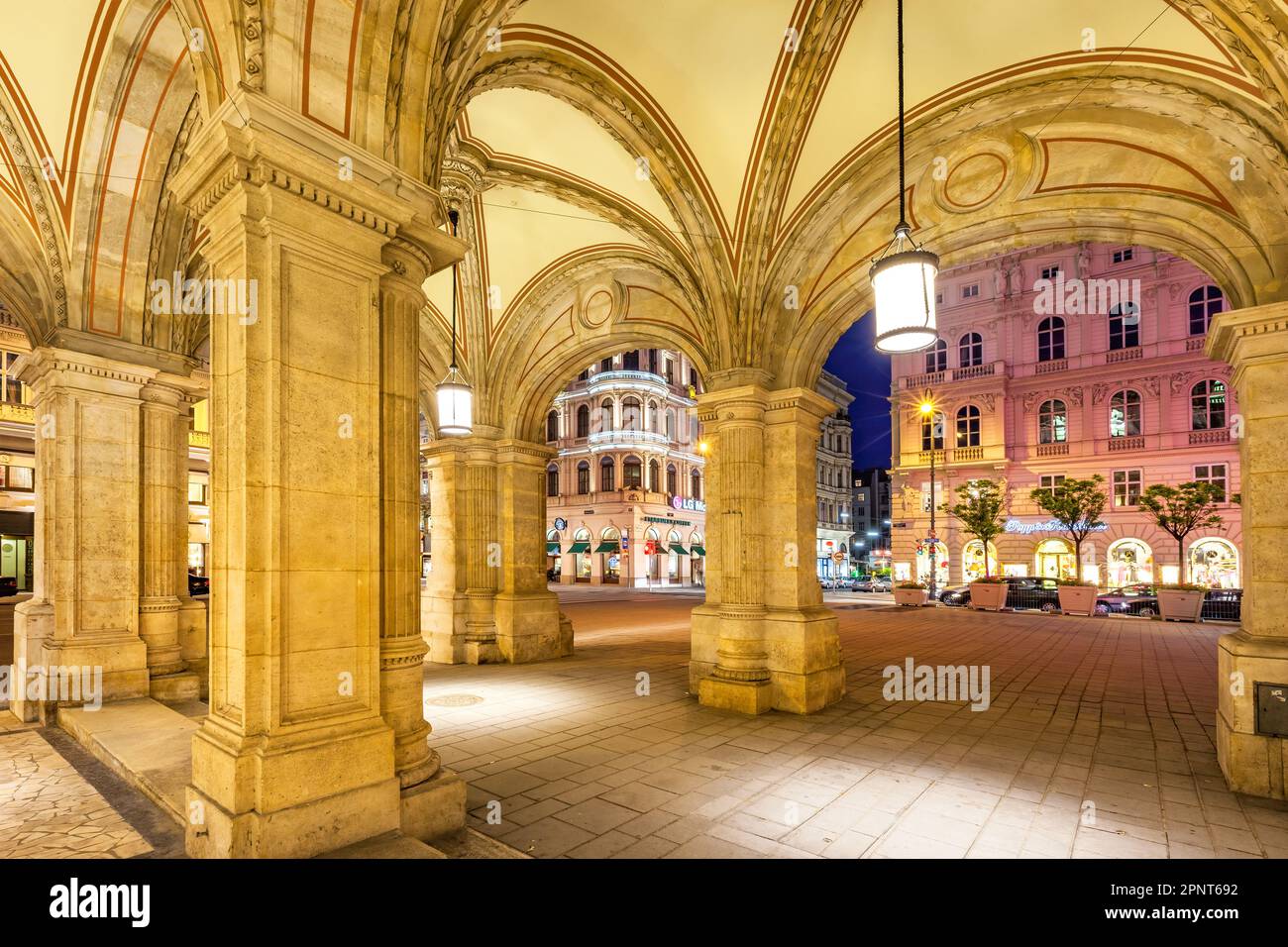 Illuminated arcades of the State Opera House in Vienna, Austria at ...