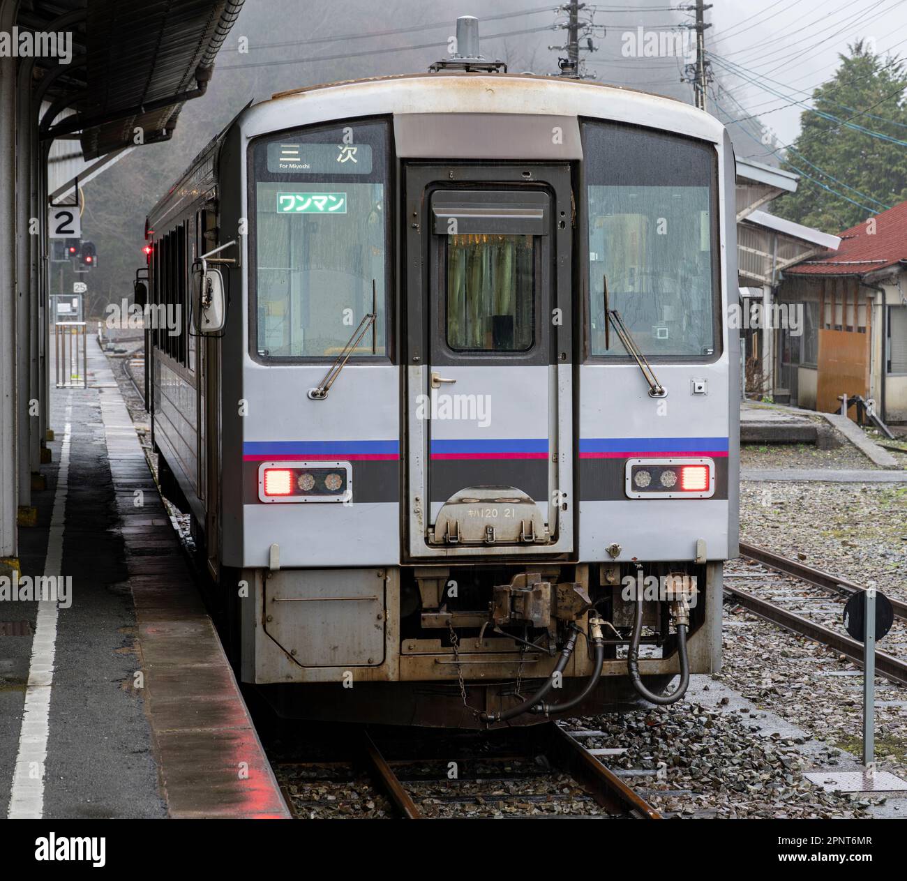 A JR West KiHa 120 Series one man train at Bingo-Ochiai Station in ...