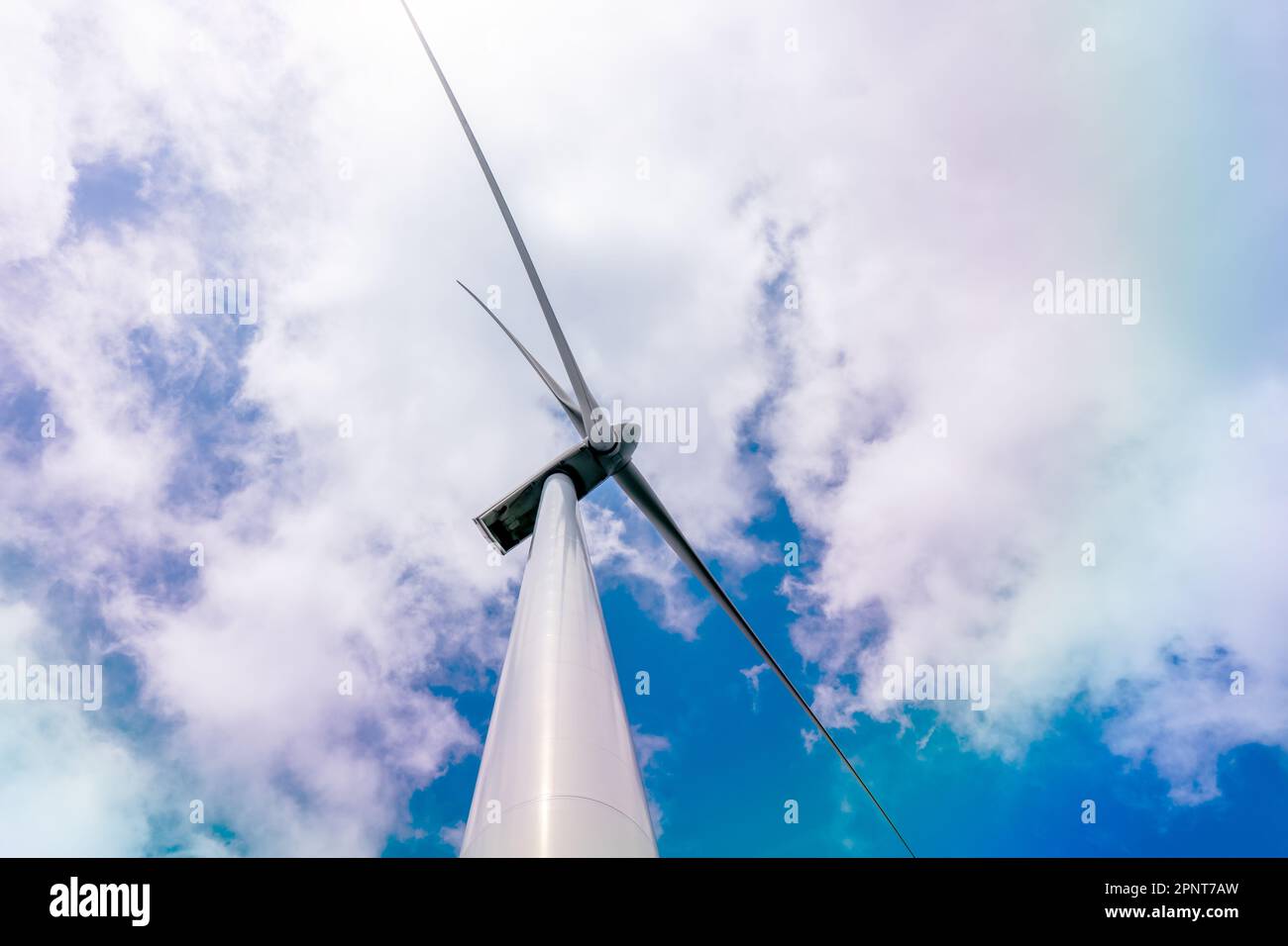 Bottom view of wind turbine generating electricity clean energy with ...
