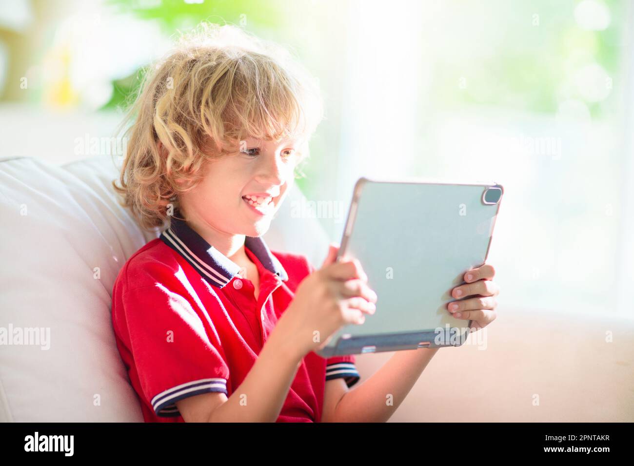 Kids with tablet computer. Child with pc watching movie or playing game ...