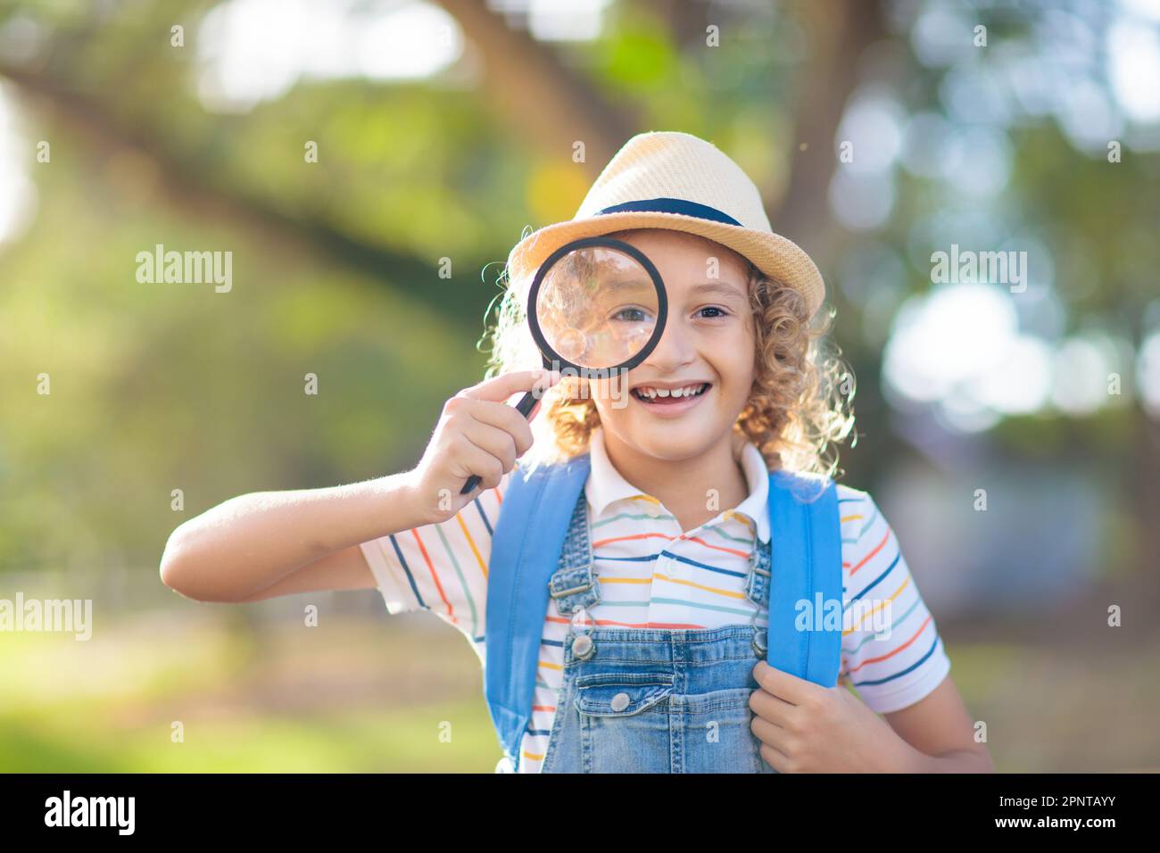 Kids explore nature. Children hike in sunny summer park. Scout club and ...