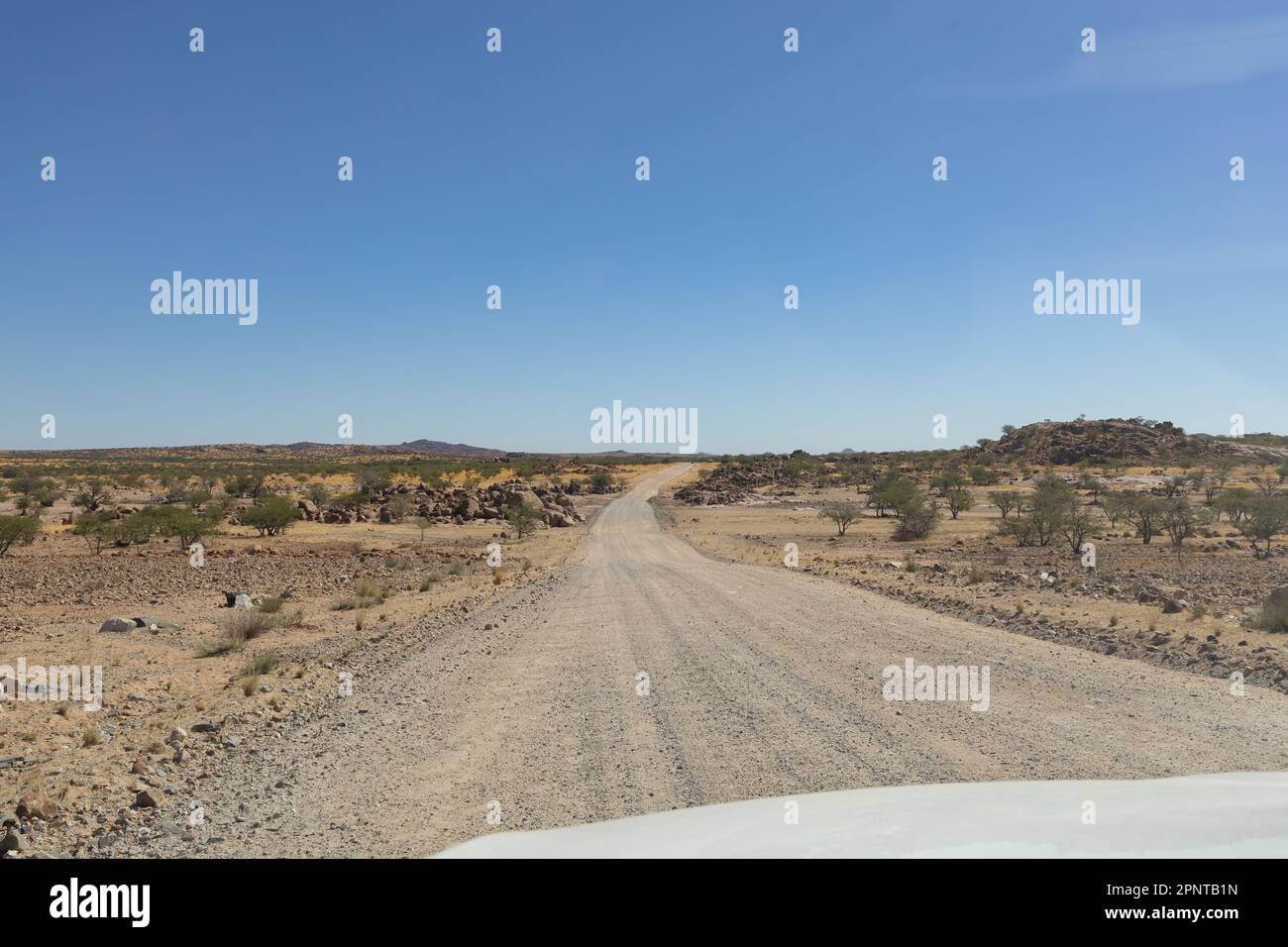scenic view through the windscreen on a gravel road in Namibia Stock ...