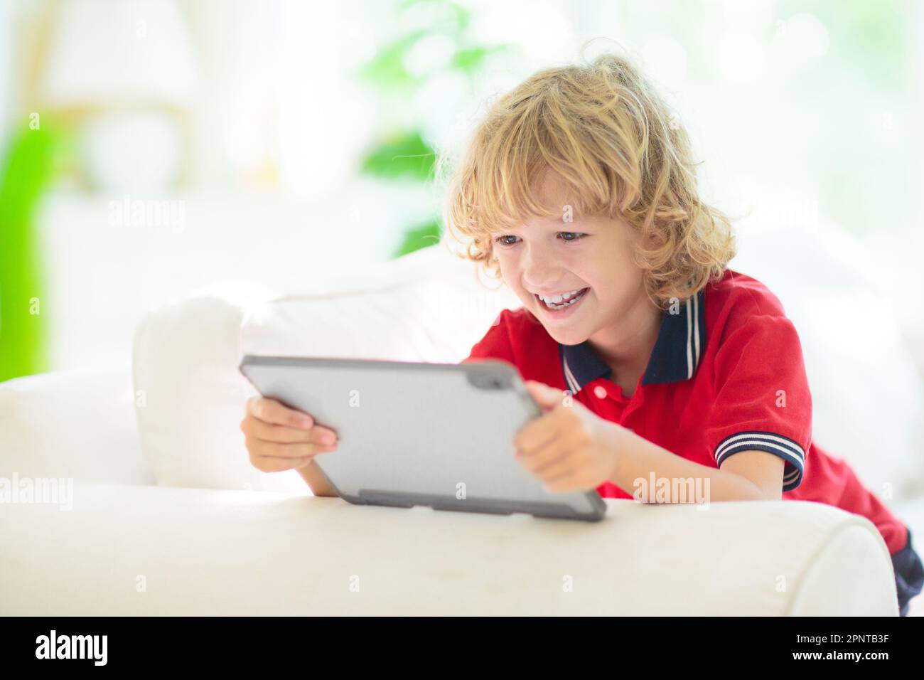 Kids with tablet computer. Child with pc watching movie or playing game ...