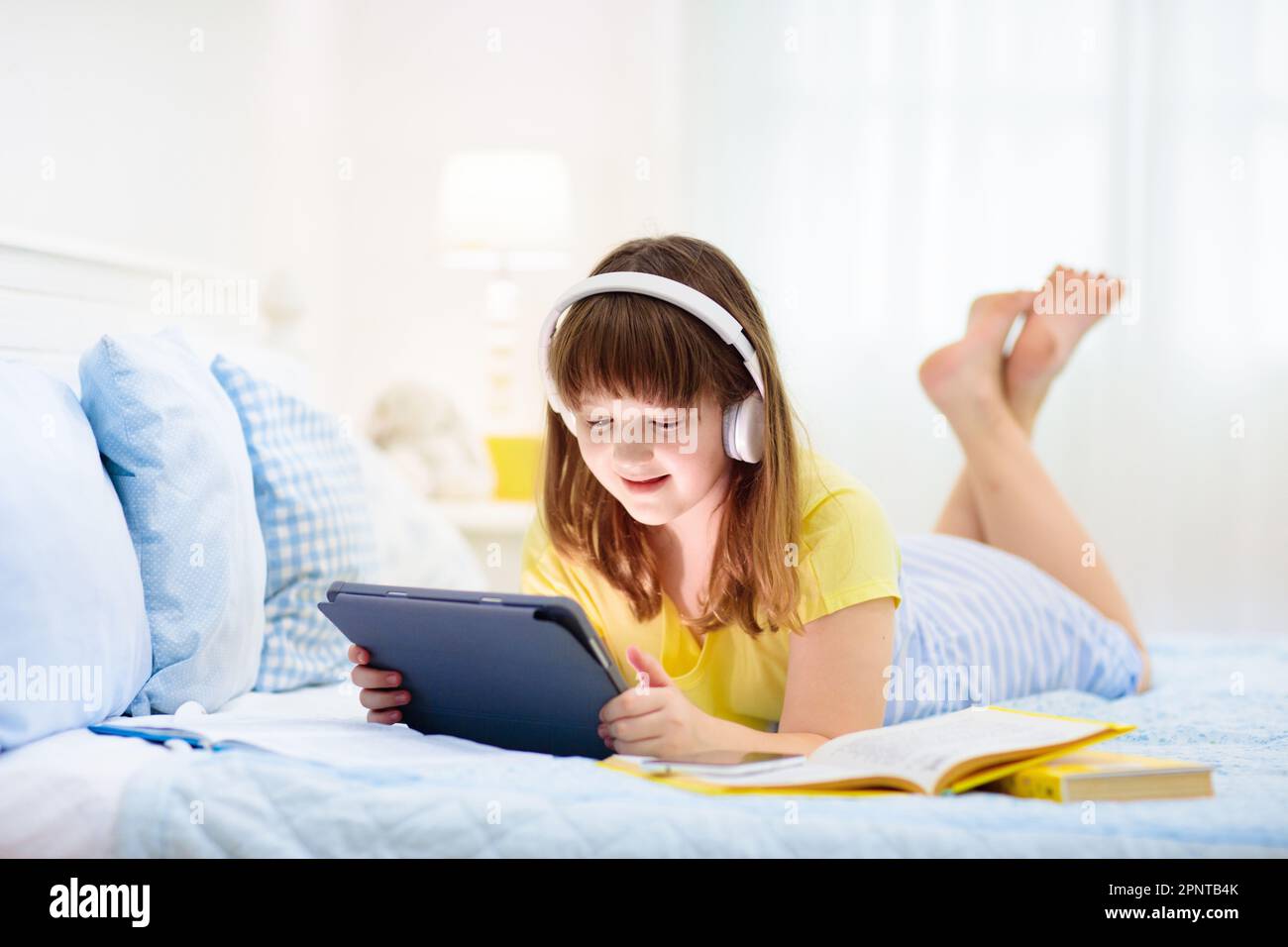 Teenager girl with tablet computer. Teen kid texting and playing online ...