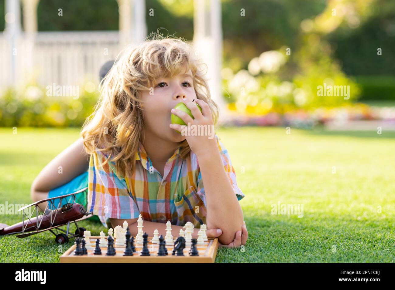 Little kid chessman play chess game, checkmate. Child playing chess ...