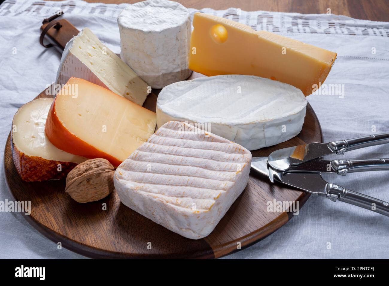 Collection of Belgian cheeses, soft yellow cow milk cheese with white ...