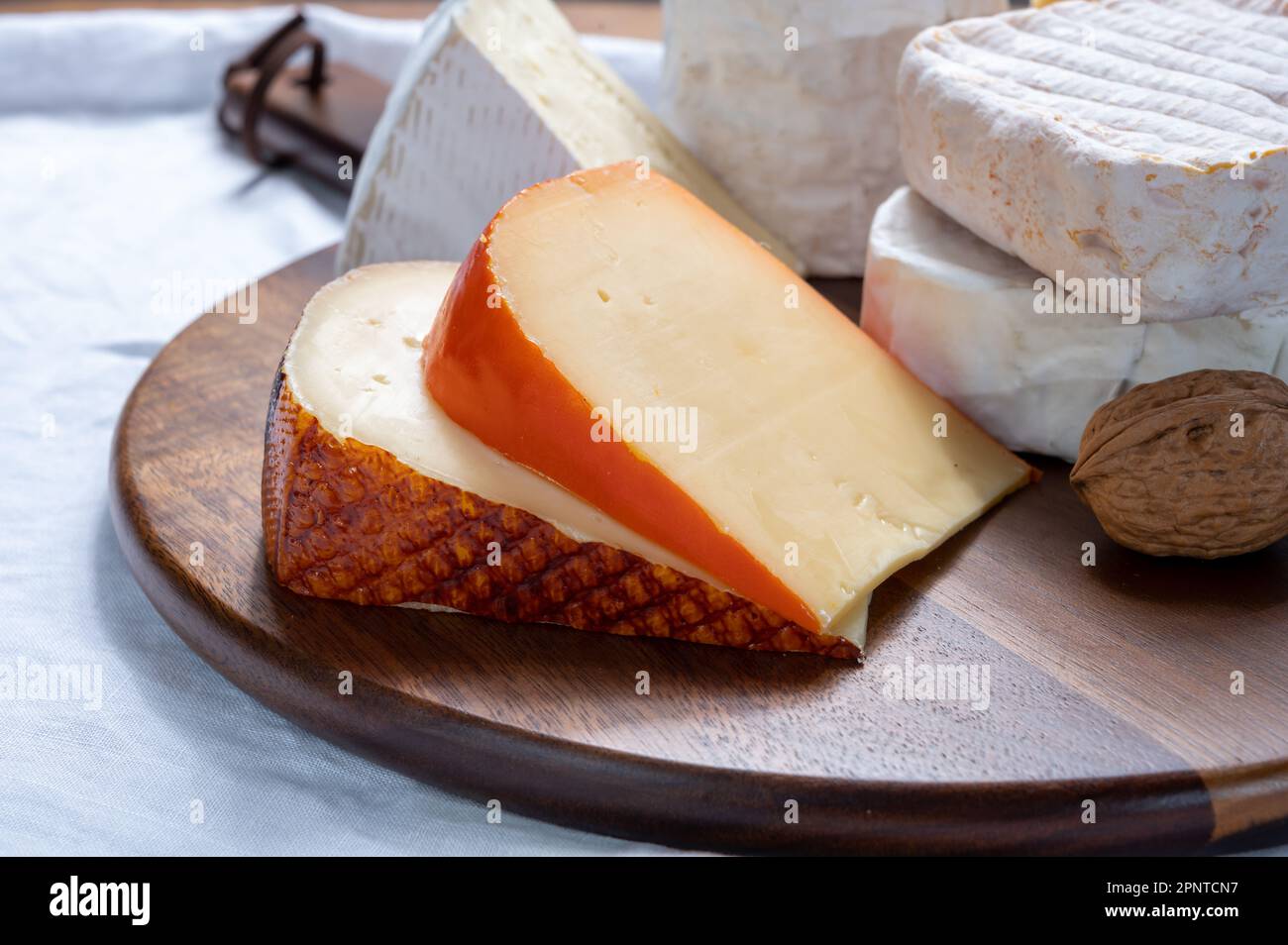 Collection of Belgian cheeses, soft yellow cow milk cheese with white ...