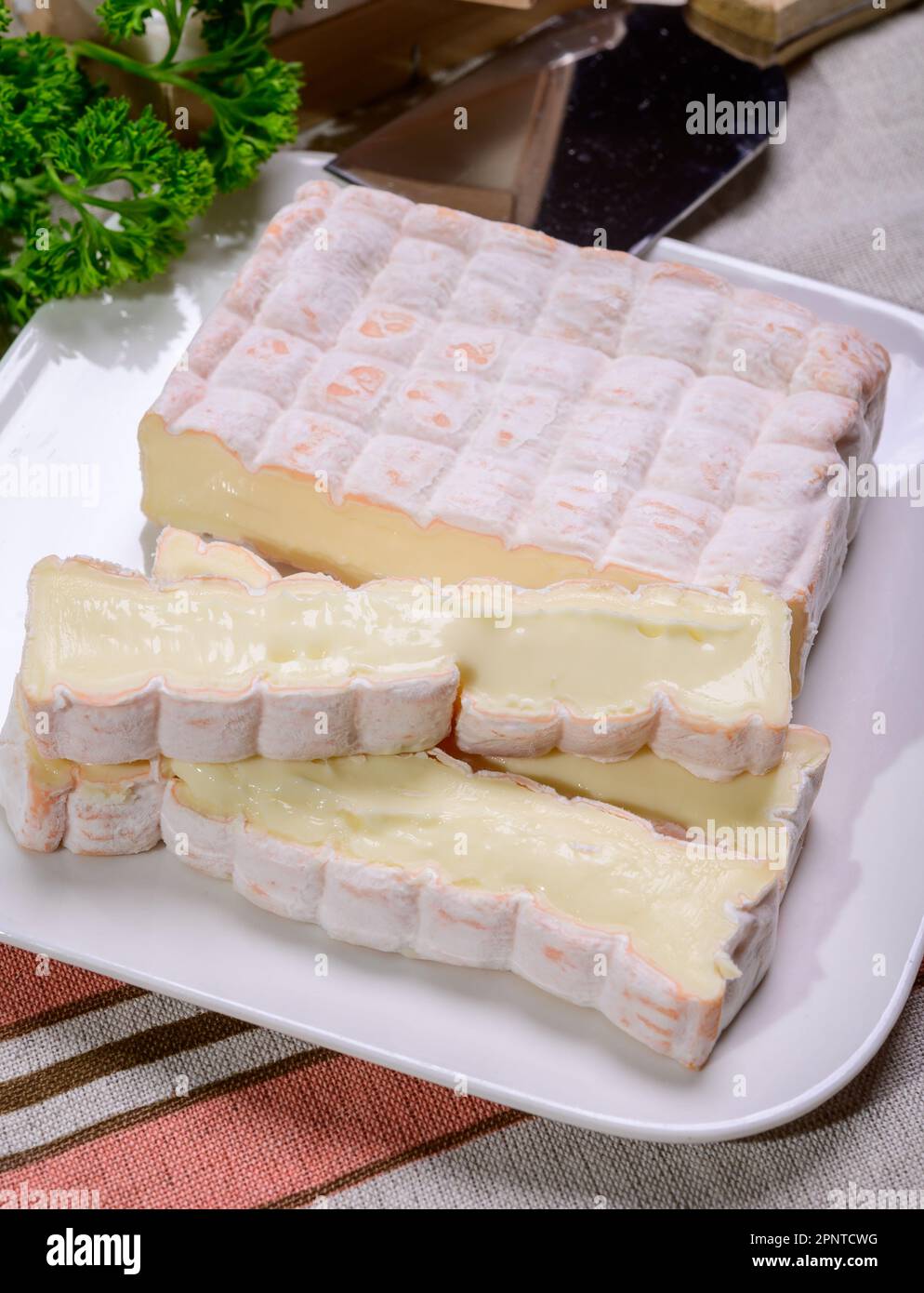 French cheeses collection, yellow Vieux Pane cheese with white mold ...