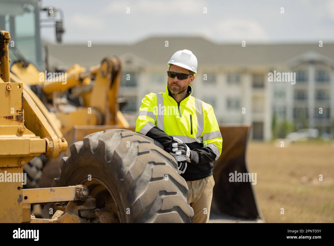 Excavator loader tractor and buider worker. Hispanic 40 s builder on ...